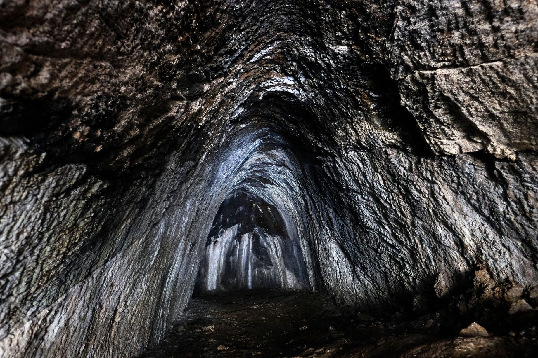 Inside mysterious woodland cave where Neolithic axe was found ...